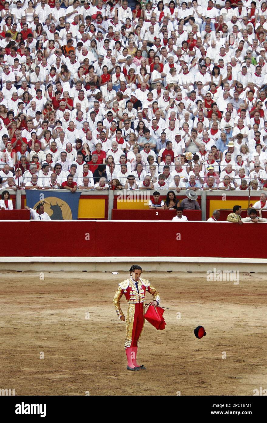 Santiago Ambel Posada, from Spain, throws his traditional bullfighter ...