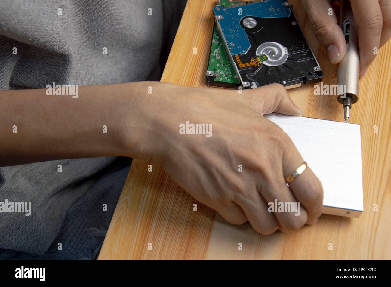 top view, man assembling an external hard drive Stock Photo - Alamy
