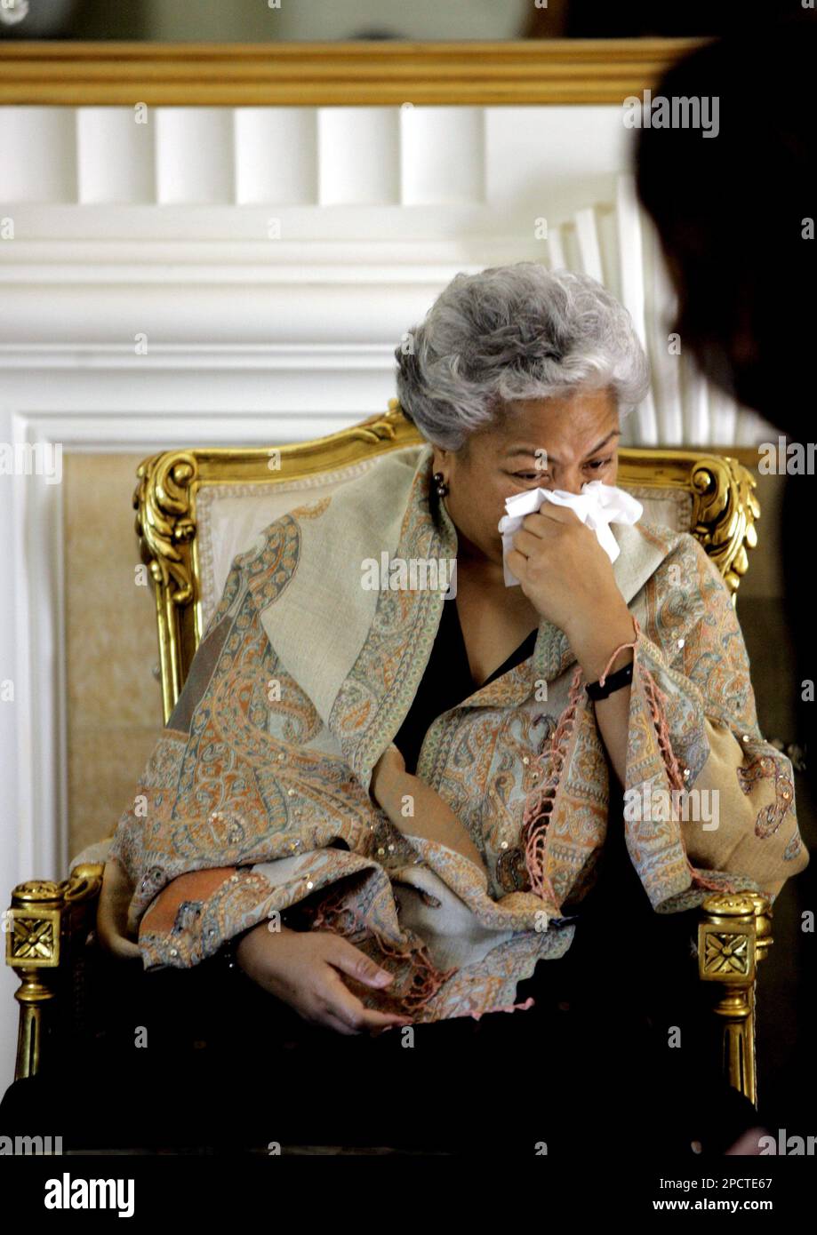 Princess Mele Siu'ilikutapu, sister of Princess Kaimana, wipes her nose ...