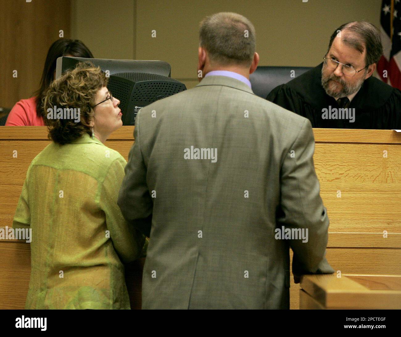 Toby Young, left, looks at district court judge Fredrick Stewart, right ...