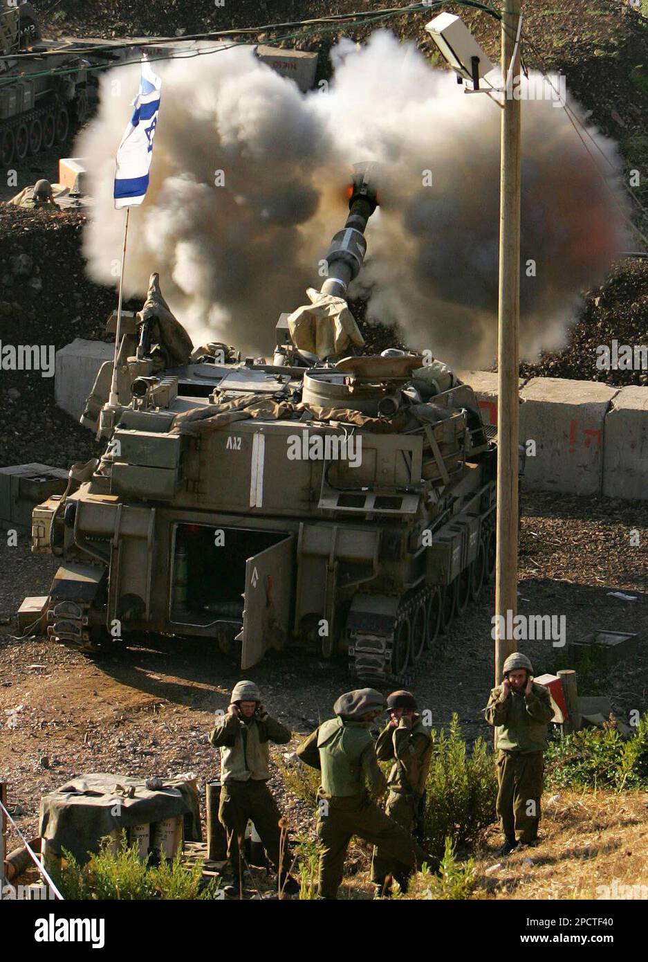 An Israeli artillery unit fires across the border into southern Lebanon ...