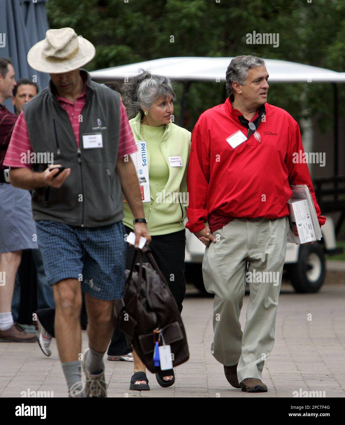 Former CIA director George Tenet, right, walks with his wife Stephanie ...