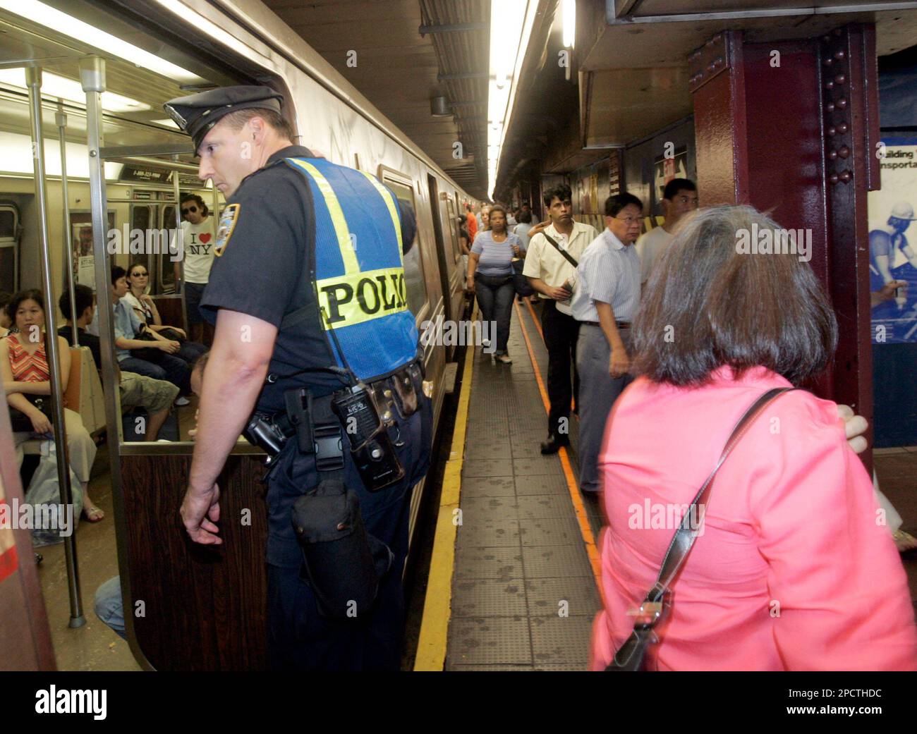 New York Police officers watch over pedestrians at the 34th street ...