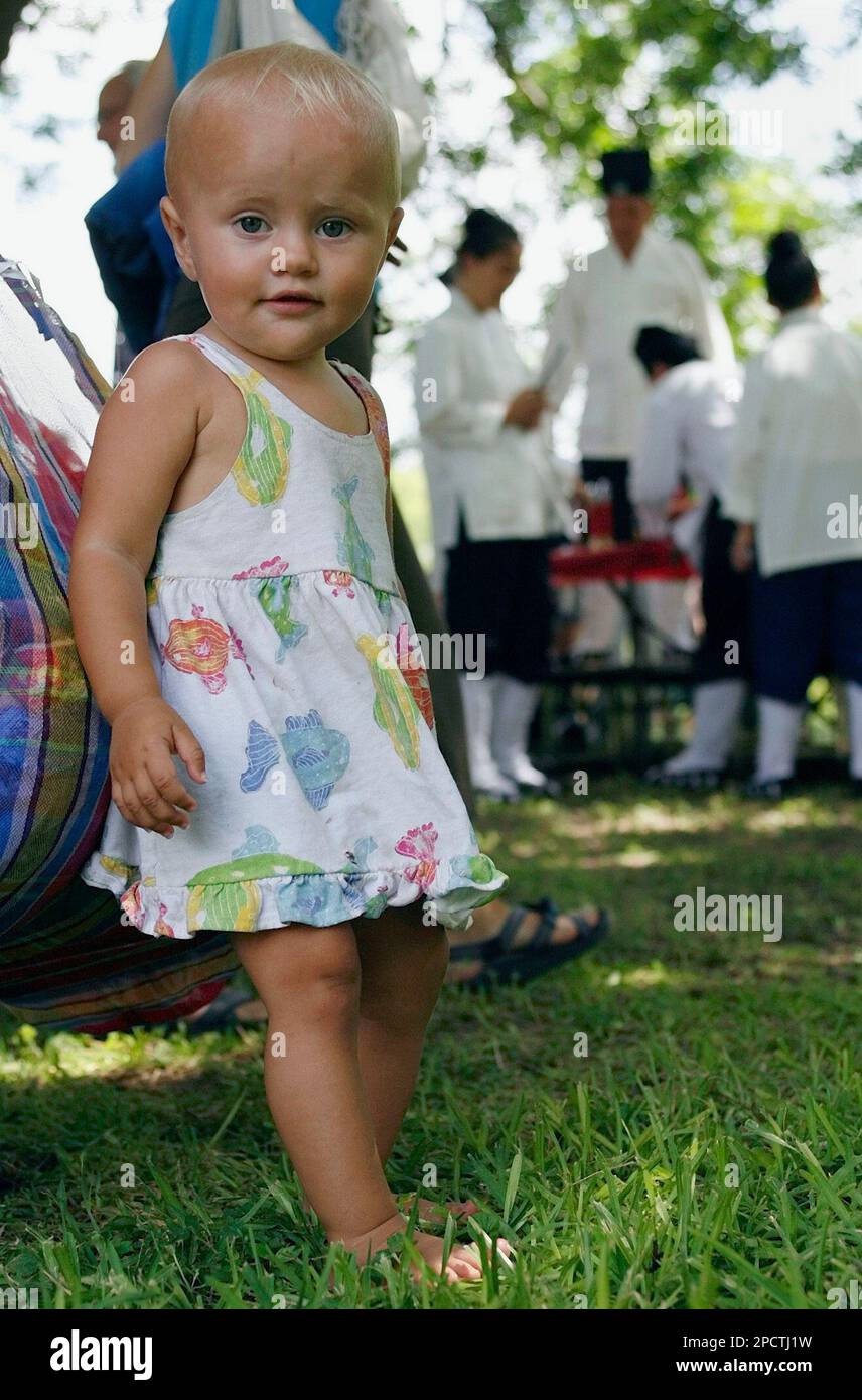 Mia Green, 15-months old, stands barefoot in the grass near Barton ...
