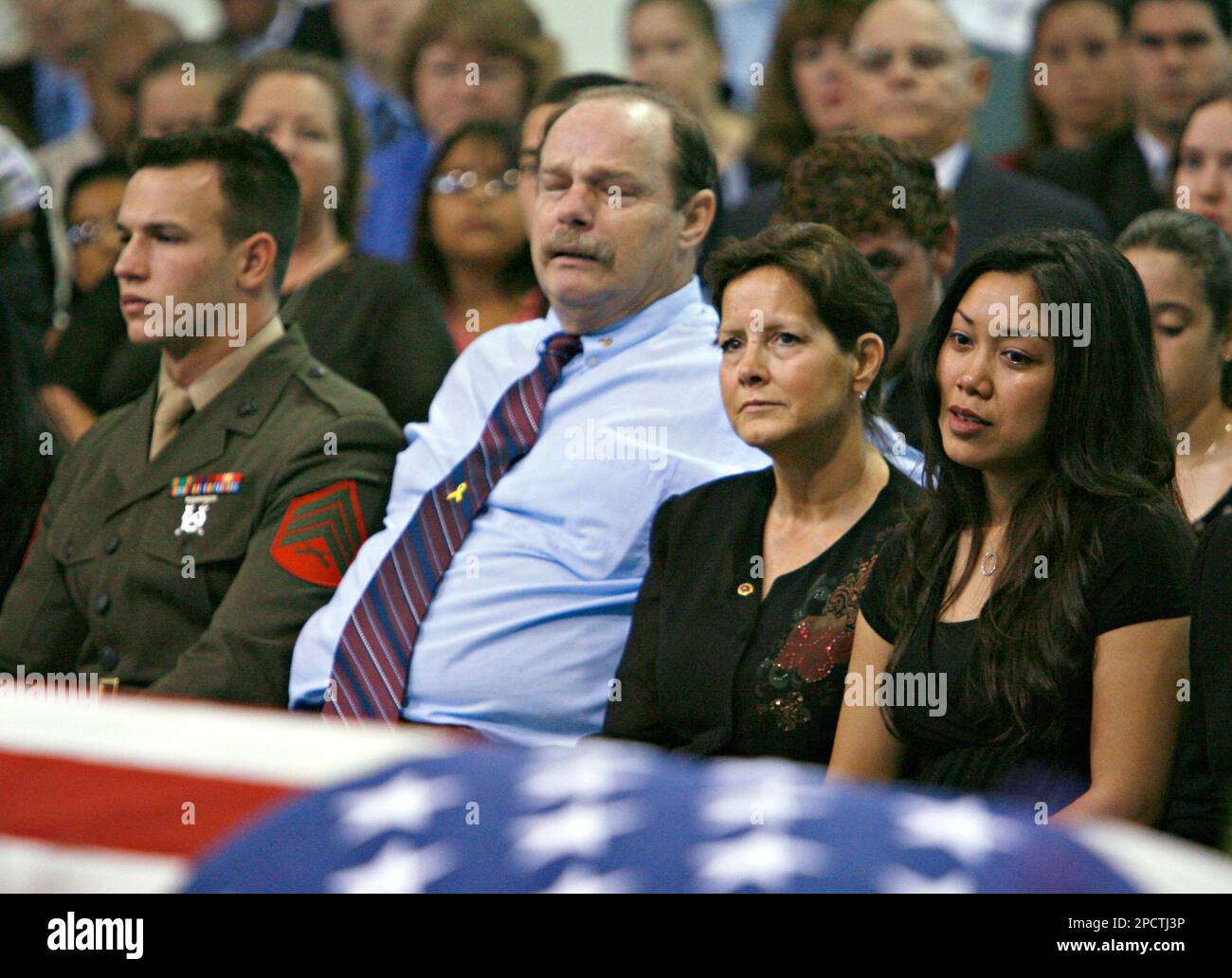 Family members of Army Sgt. Bryan Christian Luckey, from left, his ...