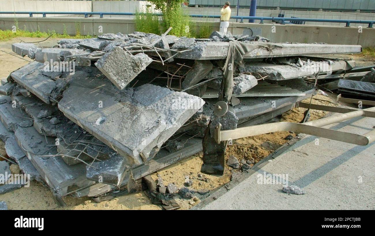 Slabs of concrete ceiling panels are shown stacked outside a Big Dig ...