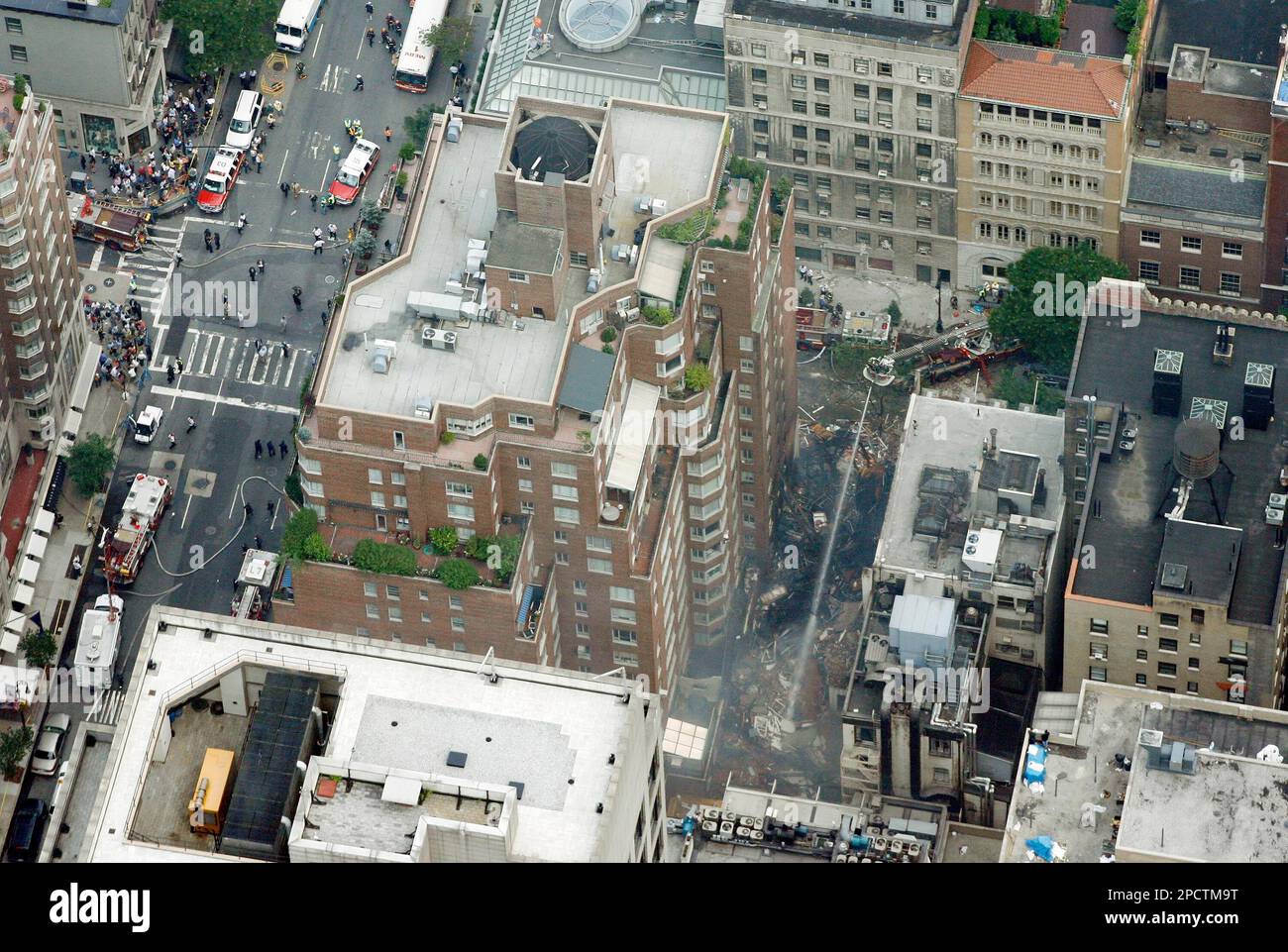 this photo shows an aerial view of the location of a collapsed building ...