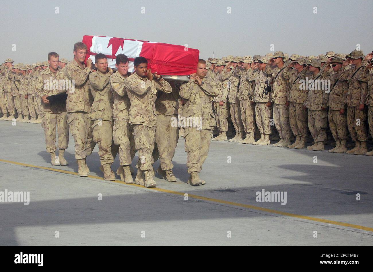 Comrades of Corporal Anthony Boneca carry his flag-draped casket toward ...