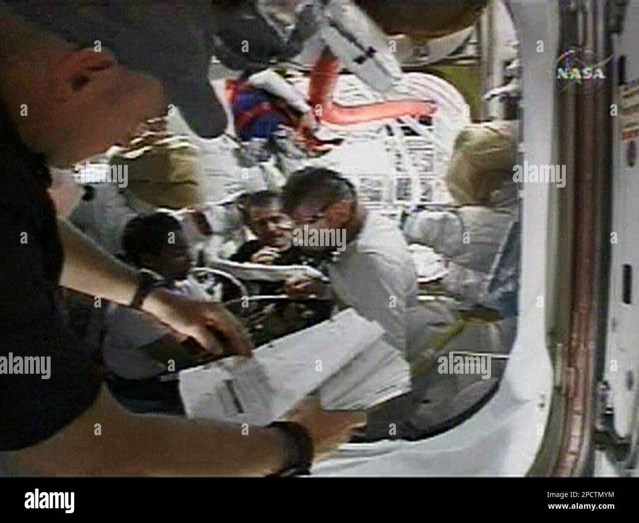 In this image made from NASA TV, pilot Mark Kelly, looks over a ...
