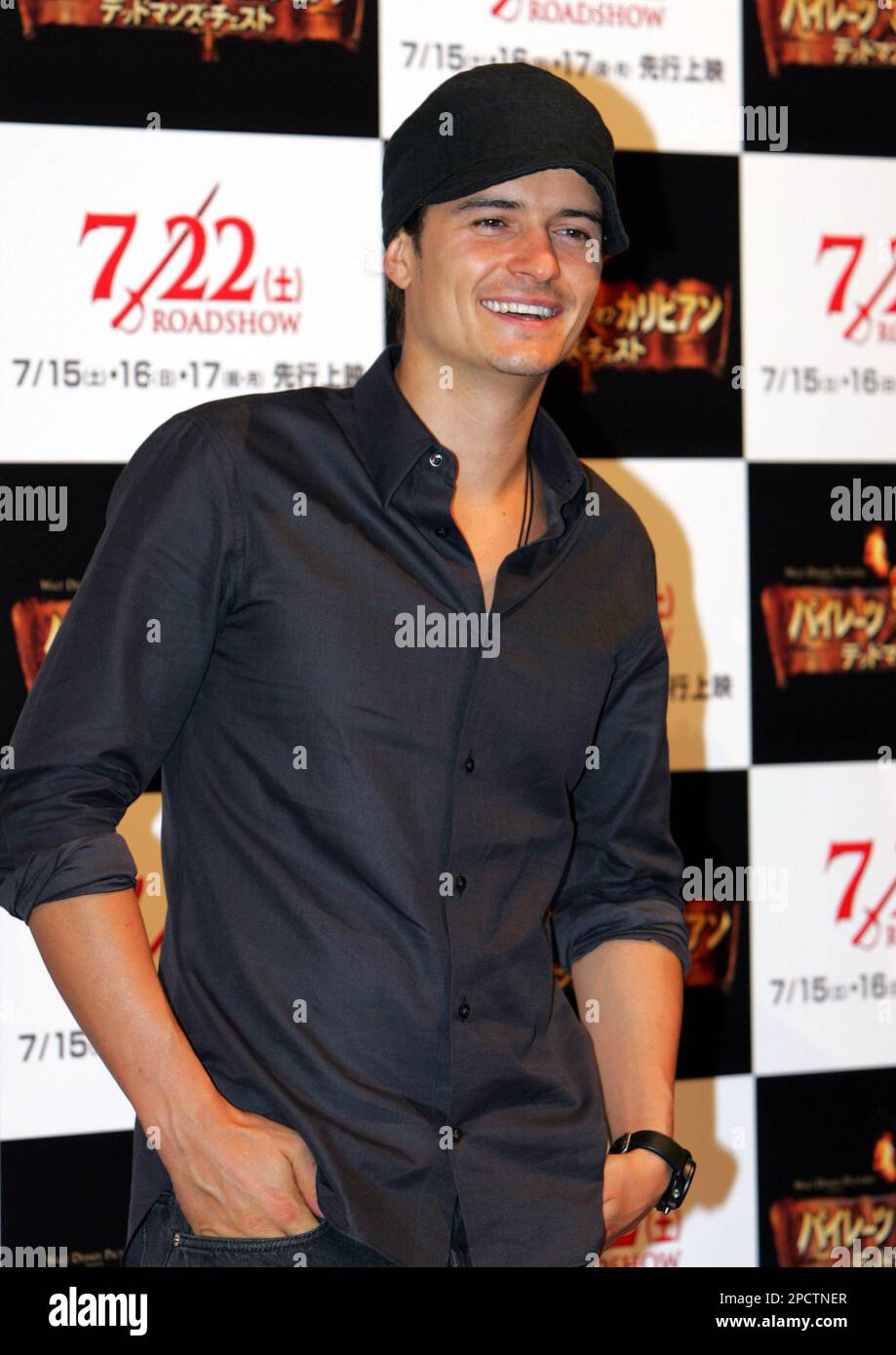British actor Orlando Bloom smiles as he poses for photographers at a ...