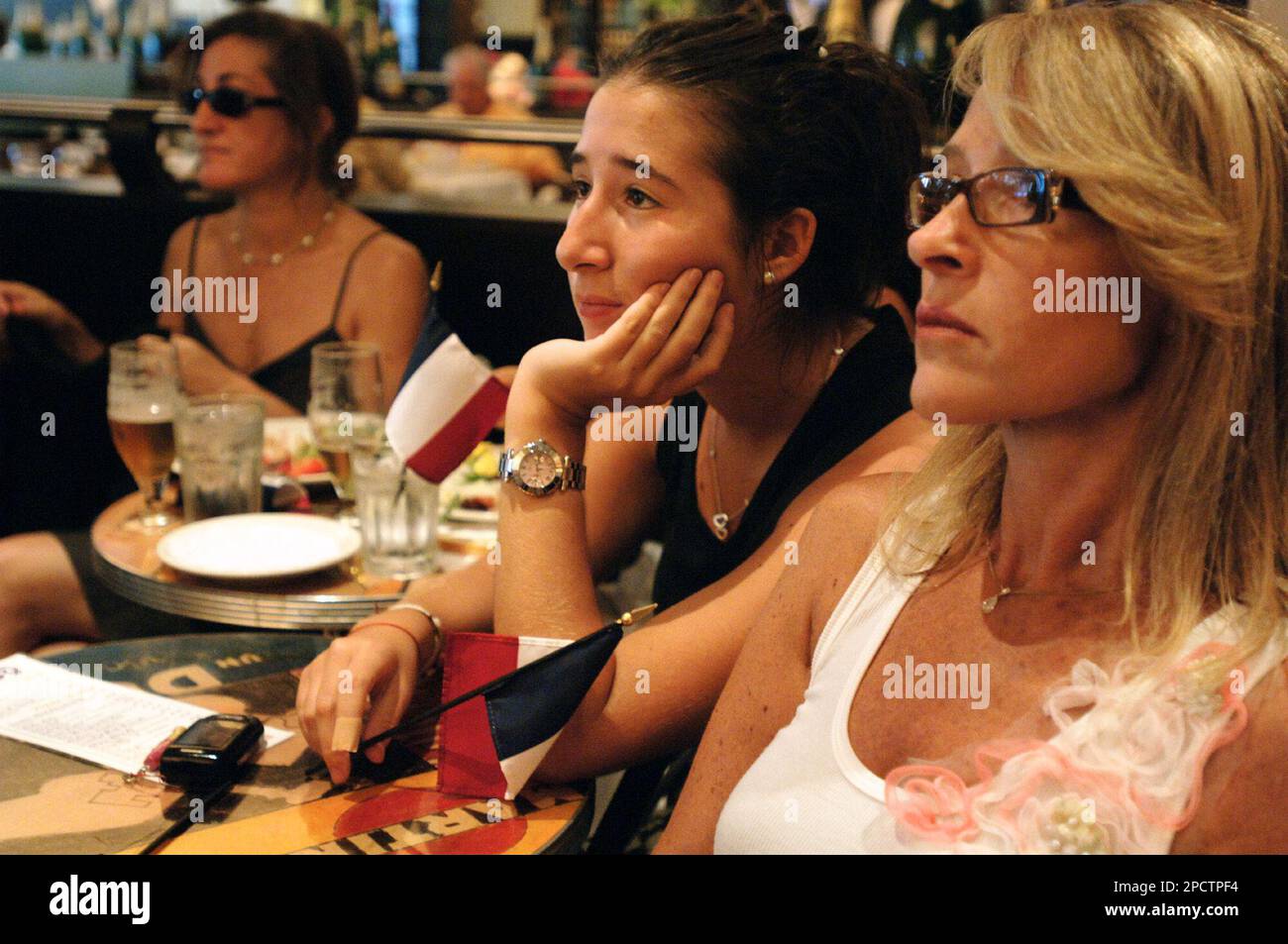 Judith Feldman, 15, center, and her mother, Mireille Feldman, right ...