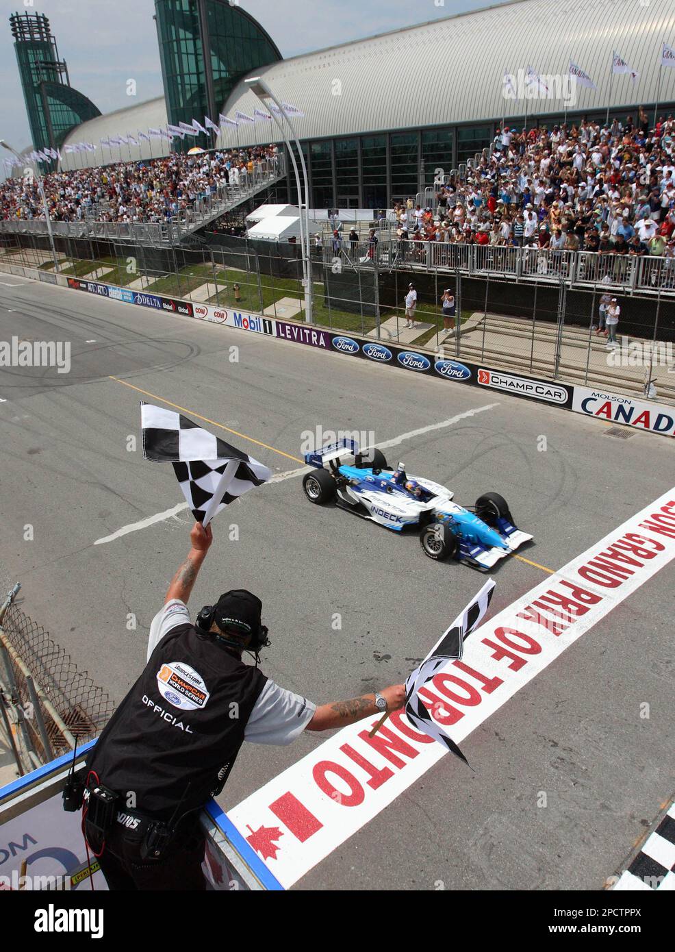 Forsythe racing driver A.J. Allmendinger crosses the line to win the ...