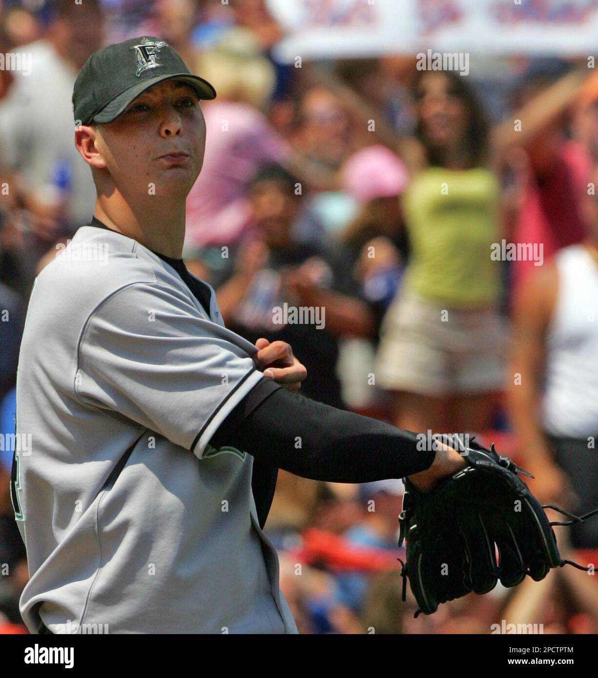 Florida Marlins' Scott Olsen reacts to New York Mets Xavier Nady's two ...