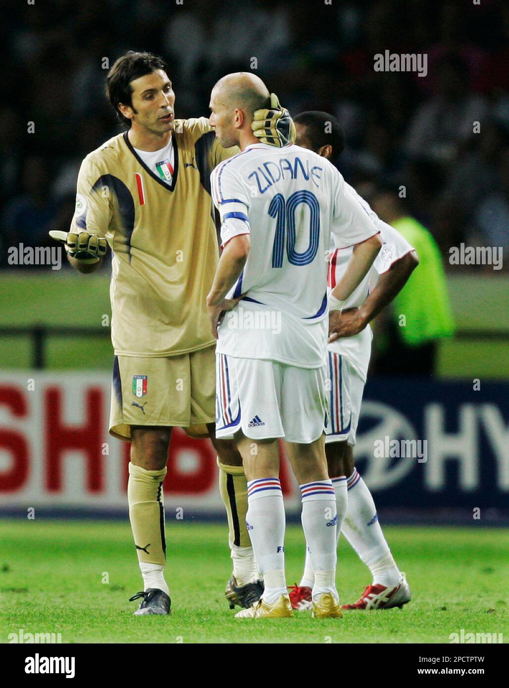 Italy's goalkeeper Gianluigi Buffon, right, talks to Zinedine Zidane ...