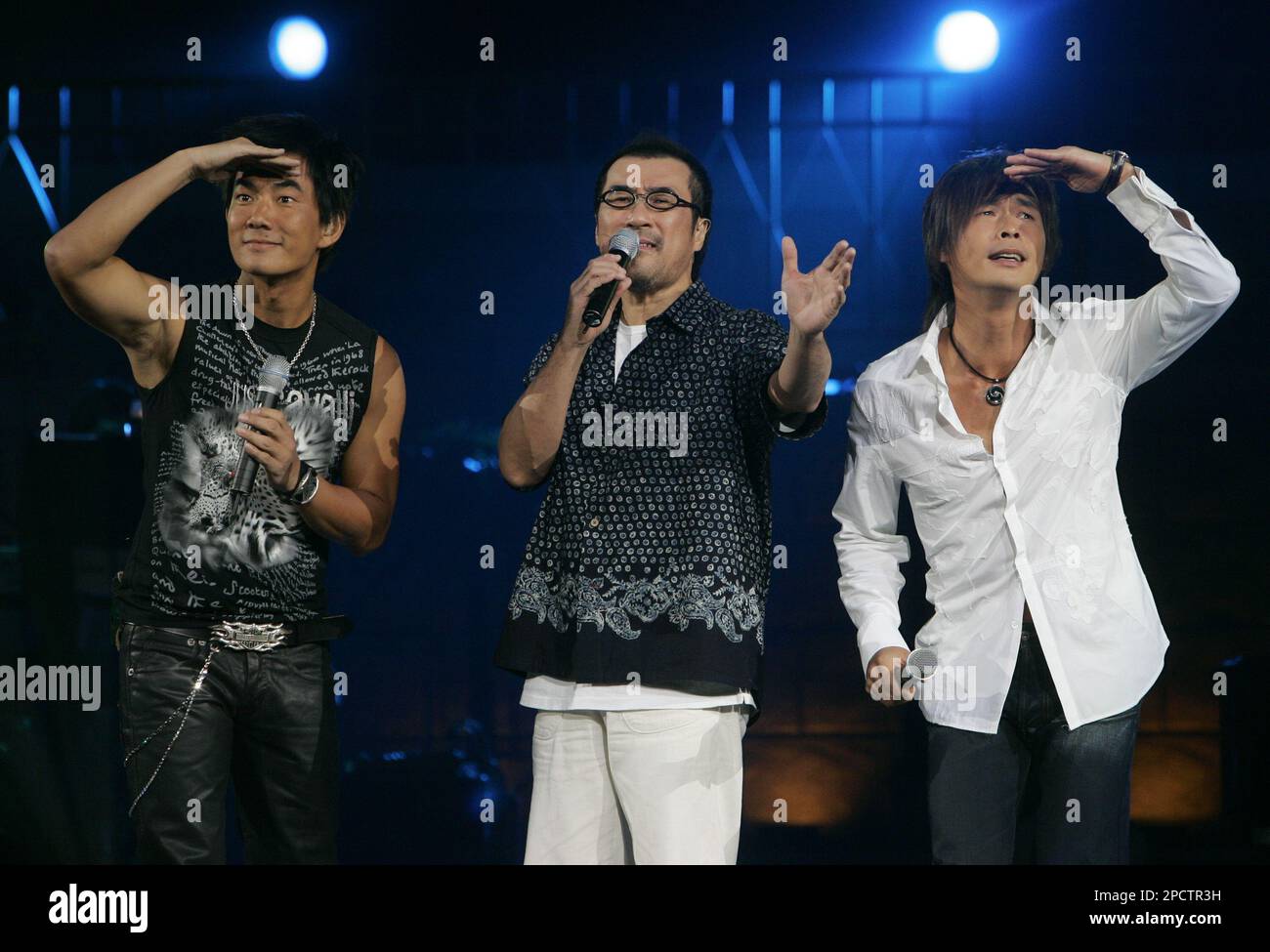 From right, Taiwan composer-singer Jonathan Lee, center, performs with ...