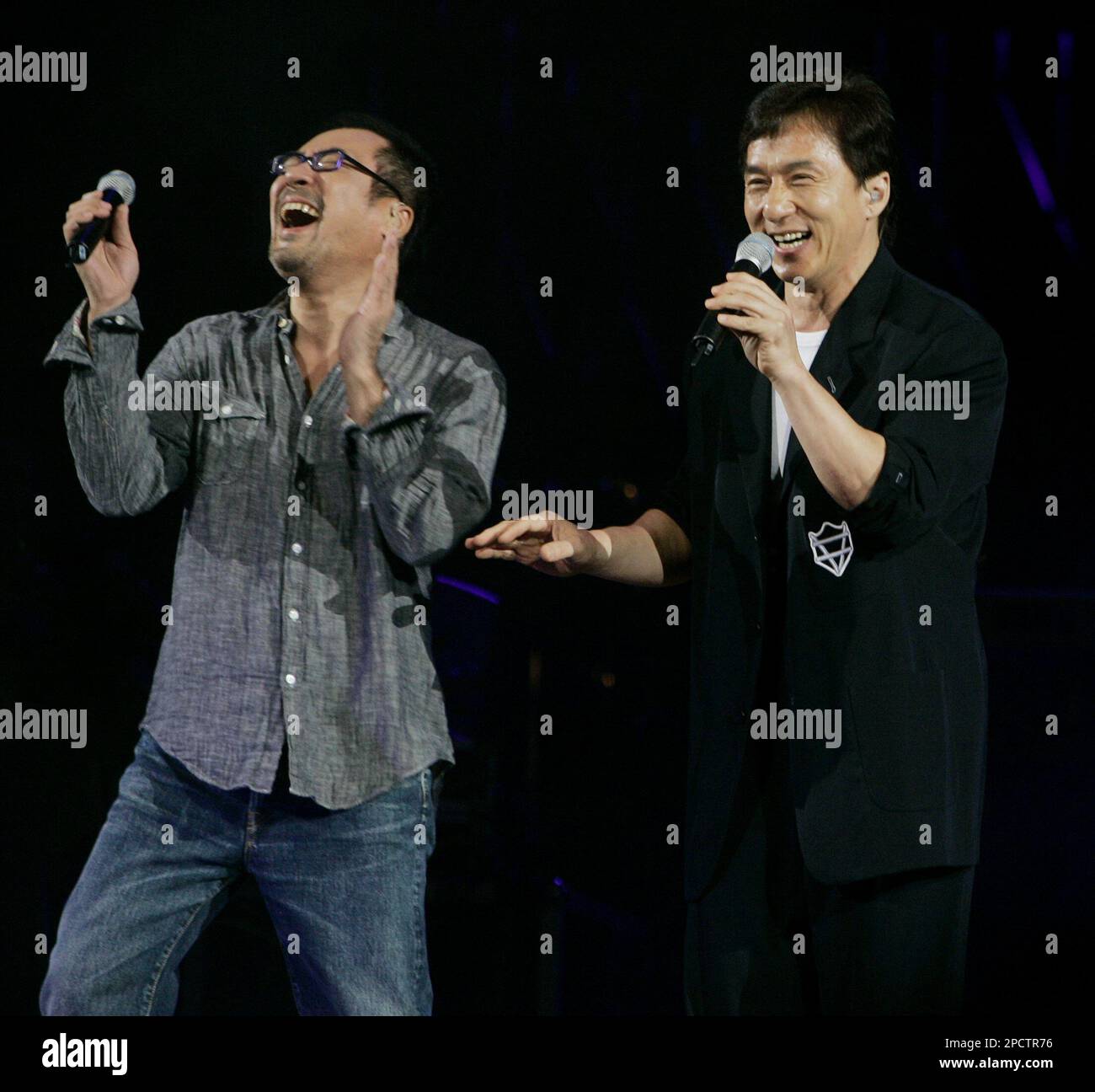 Hong Kong movie star Jackie Chan, right, sings with Taiwan composer ...