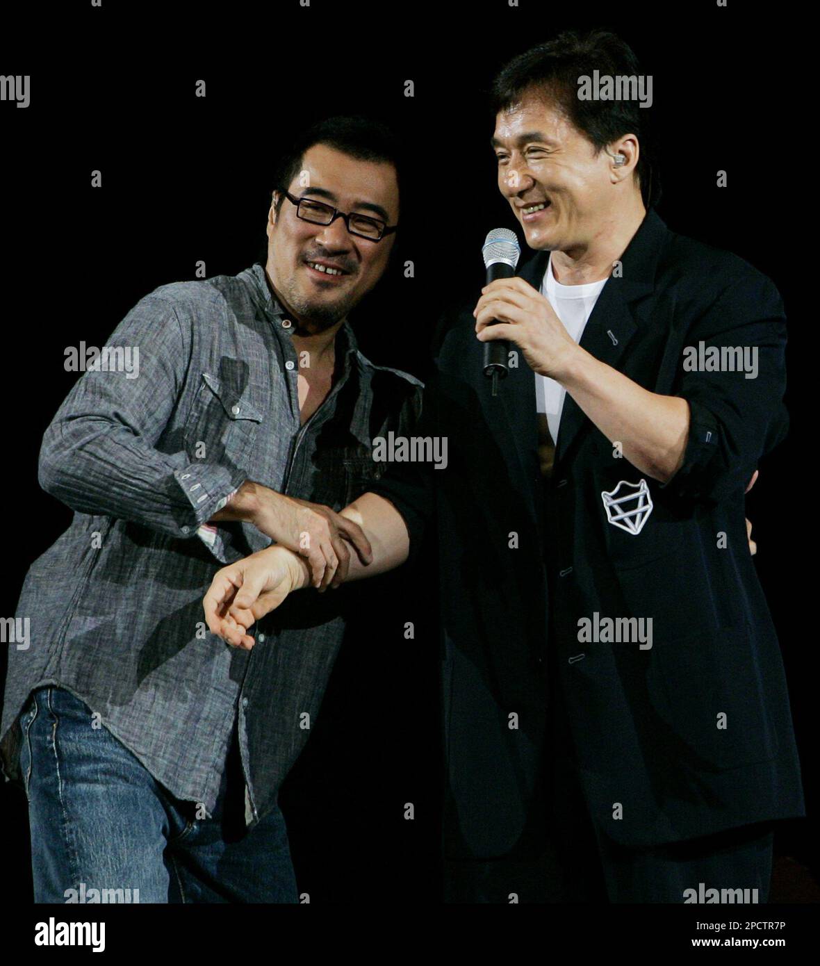 Hong Kong movie star Jackie Chan, right, sings with Taiwan composer ...