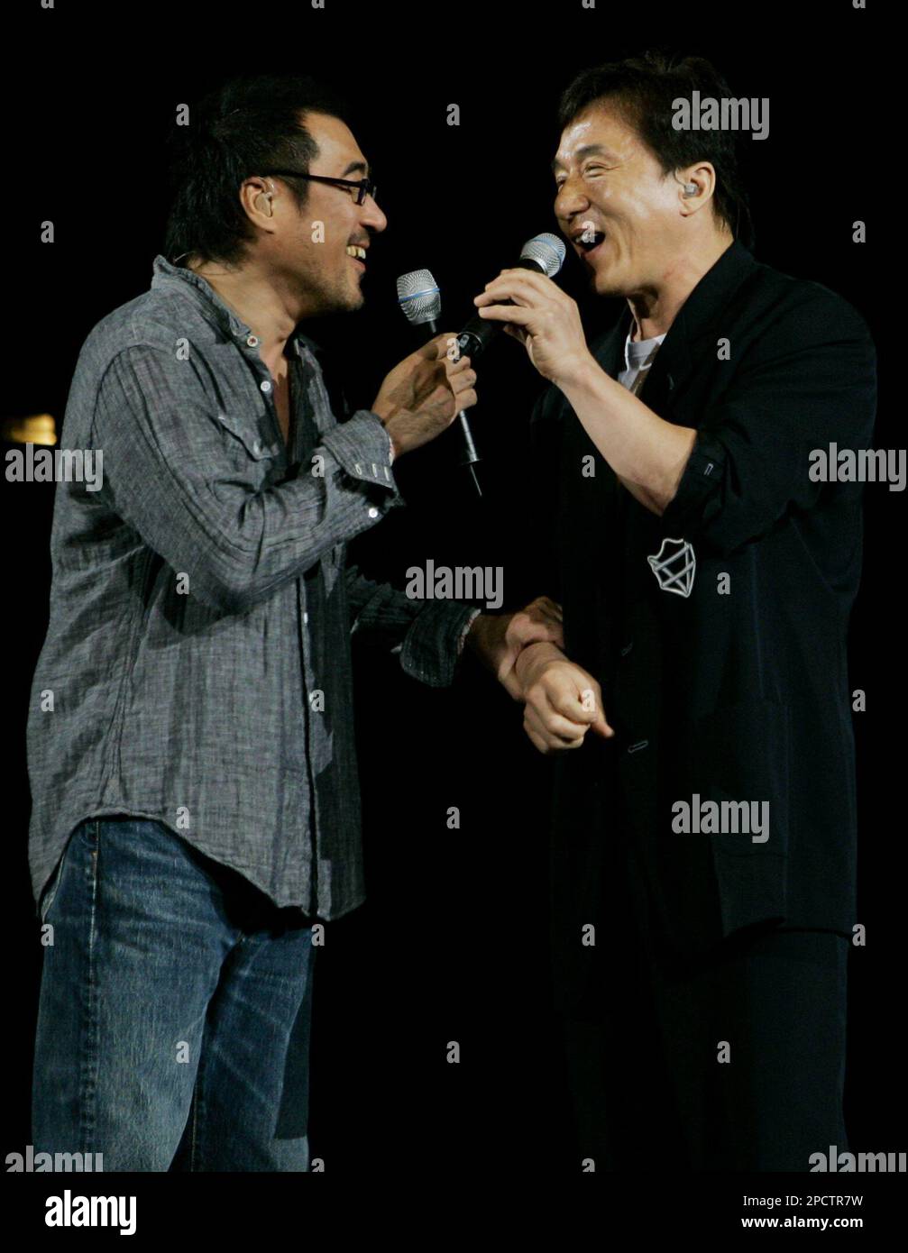 Hong Kong movie star Jackie Chan, right, sings with Taiwan composer ...