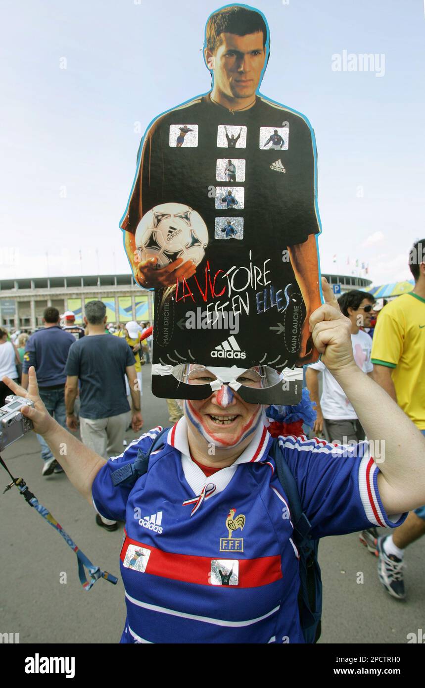 A French soccer fan with a mask made with a photograph of French soccer ...
