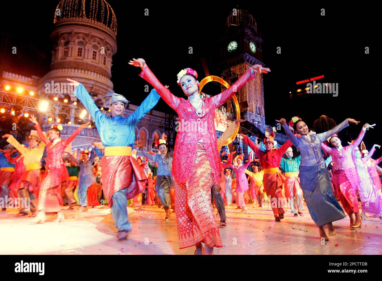 Dancers wearing traditional tribal costume perform during the ...
