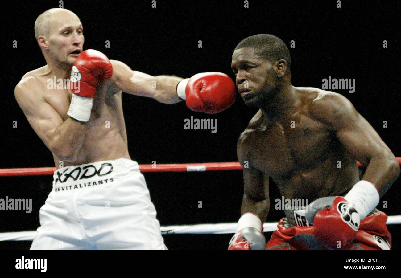 Roman Karmazin, left, of Russia connects with a jab against the face of ...
