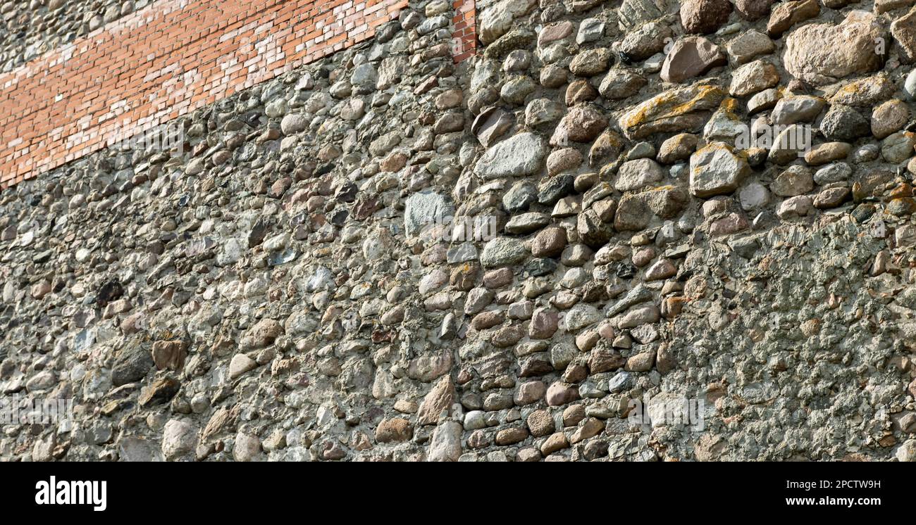 Stone wall of a large ancient castle, background. Copy space for text ...