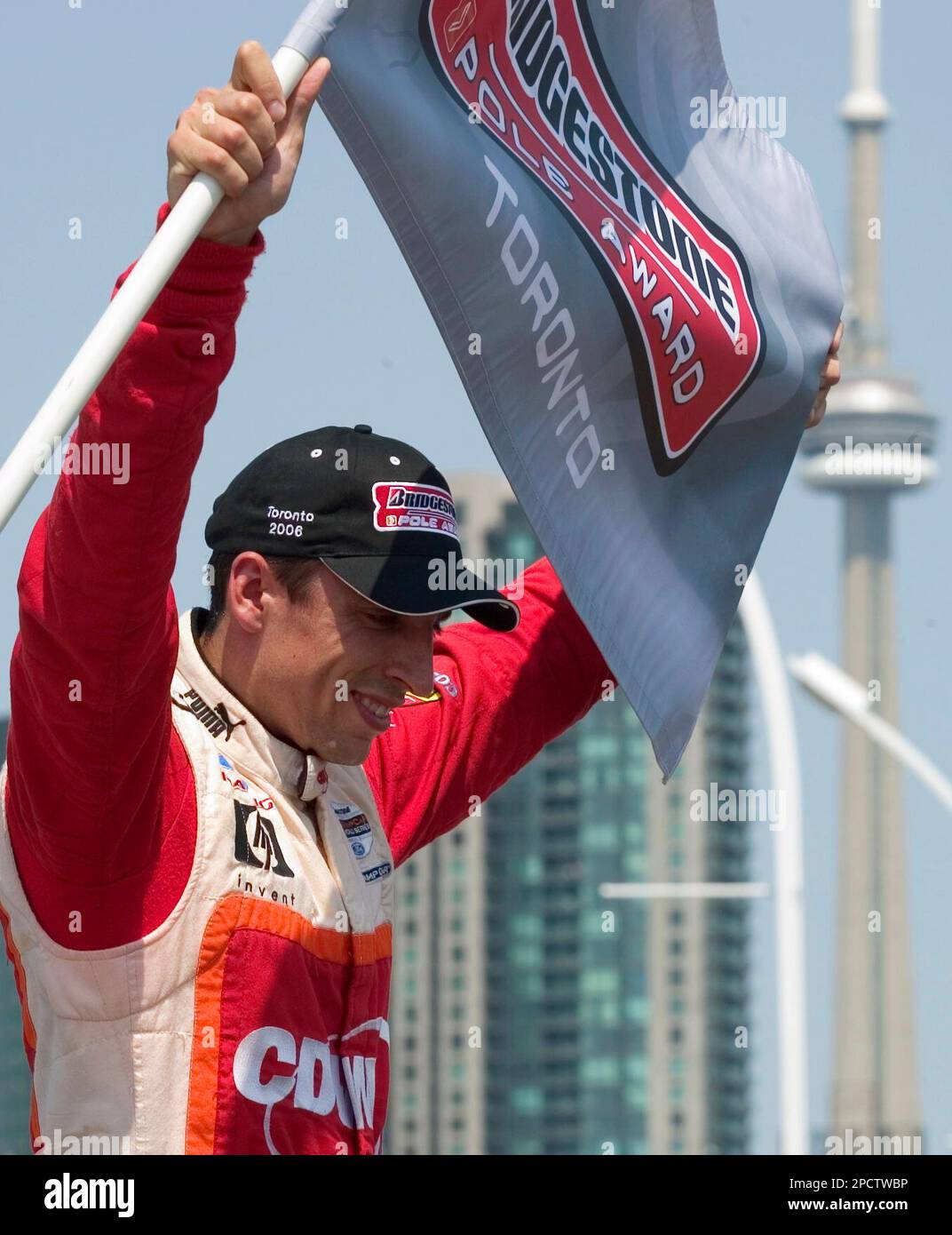 Justin Wilson celebrates after winning the pole position during ...
