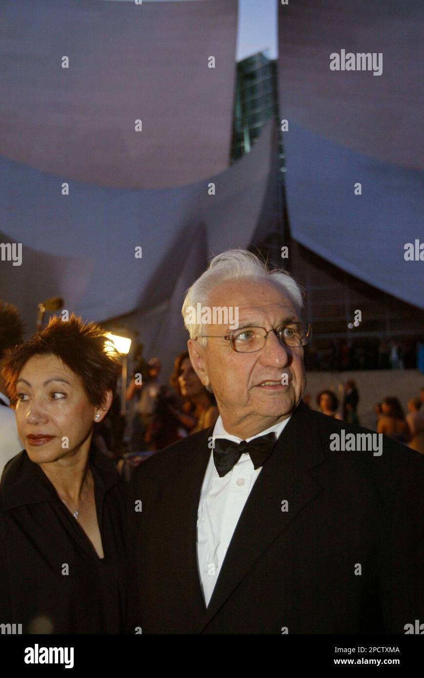 FILE *** Building architect Frank Gehry, right, is joined by his wife ...