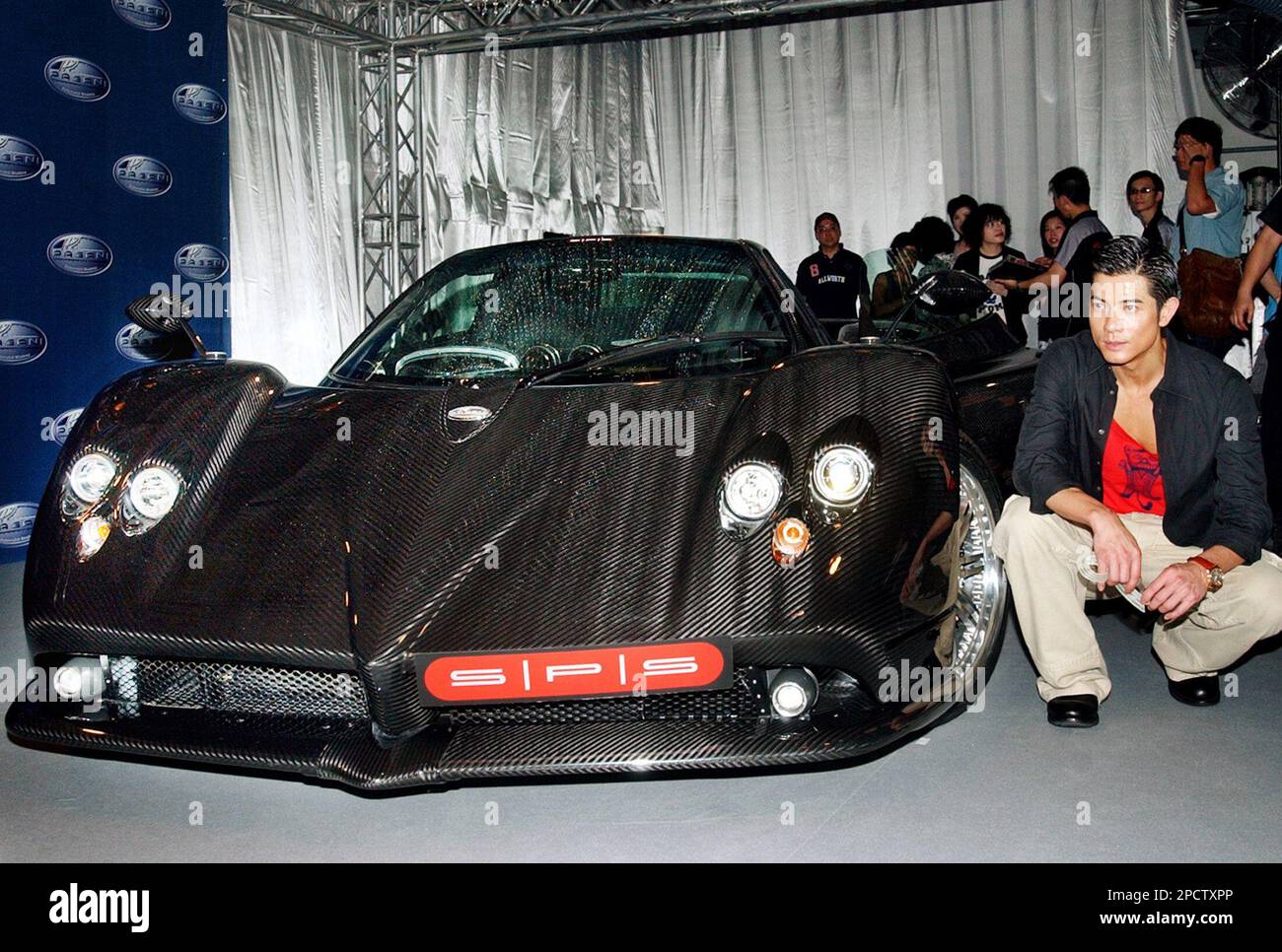 Hong Kong actor-singer Aaron Kwok poses beside his newly-purchased ...