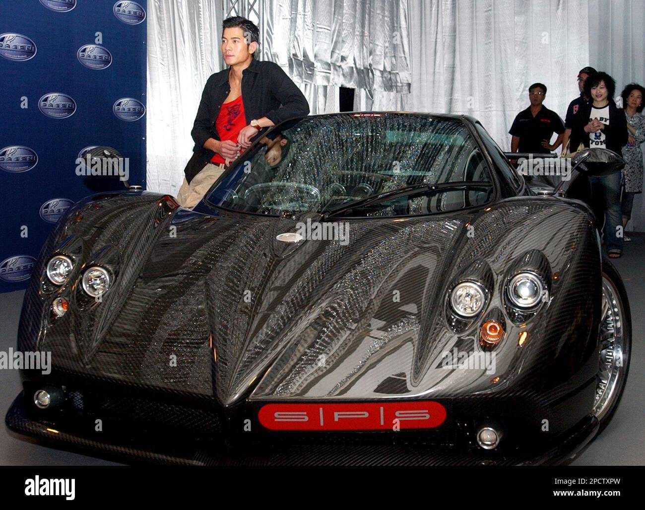 Hong Kong actor-singer Aaron Kwok poses beside his newly-purchased ...