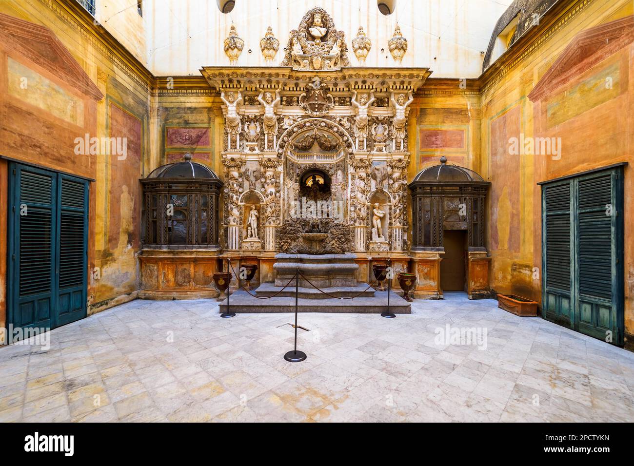 Baroque fountain with lateral aviaries built on a hanging courtyard in ...
