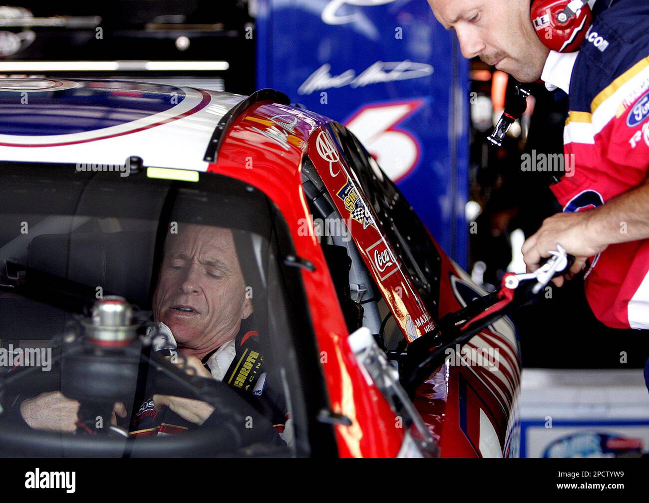 NASCAR Nextel Cup driver Mark Martin puts on his helmet as Car Chief ...