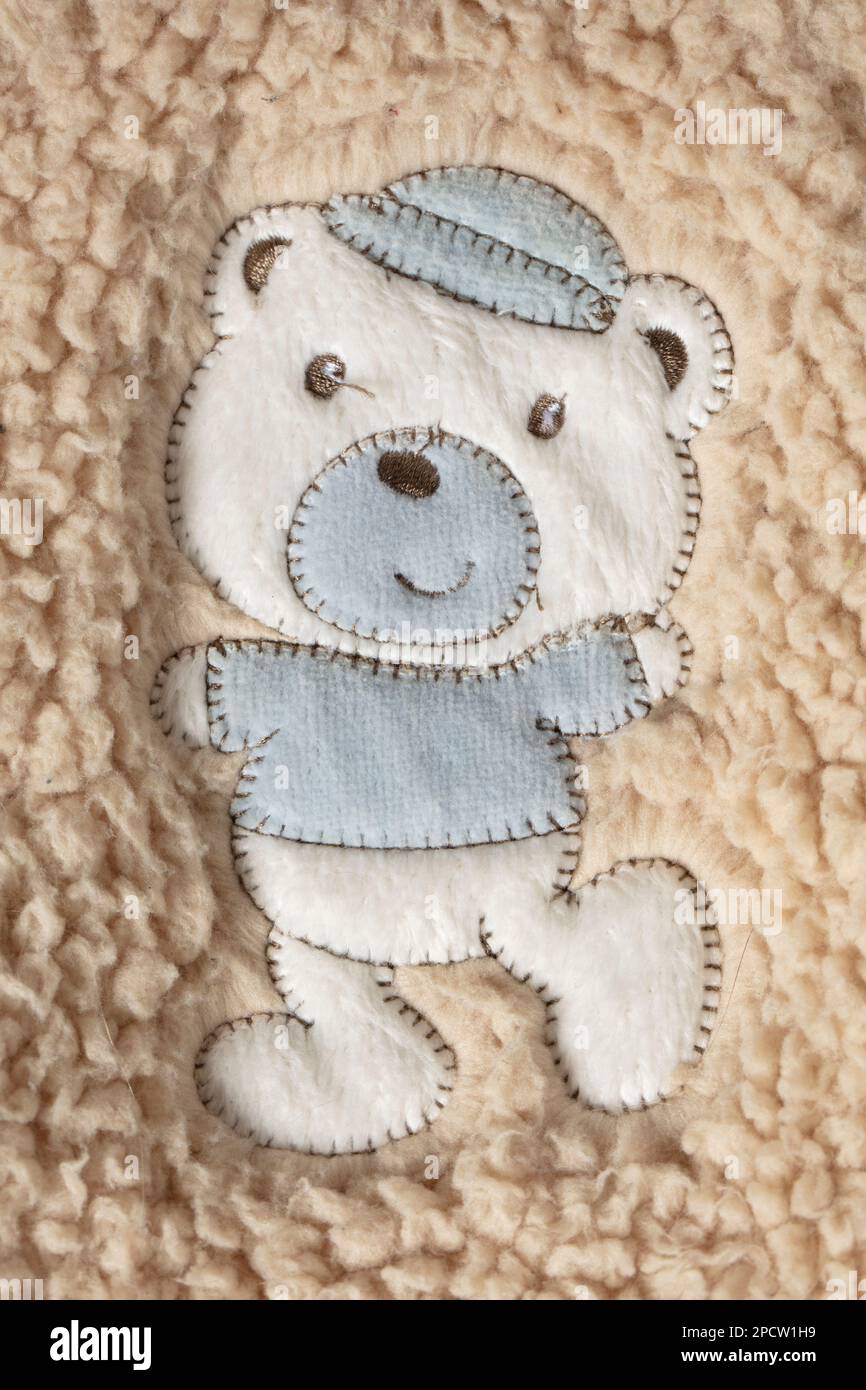 On the fur is a fabric application of a cute teddy bear Stock Photo - Alamy