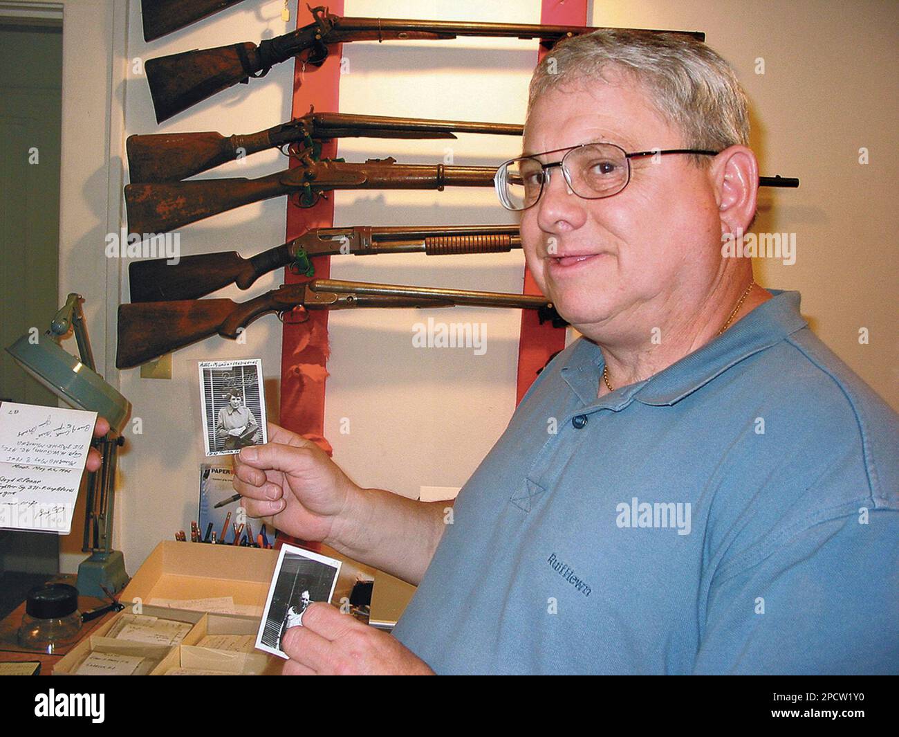 ** ADVANCE FOR SUNDAY, JULY 9 ** Paul Robinette holds up a photo of a ...
