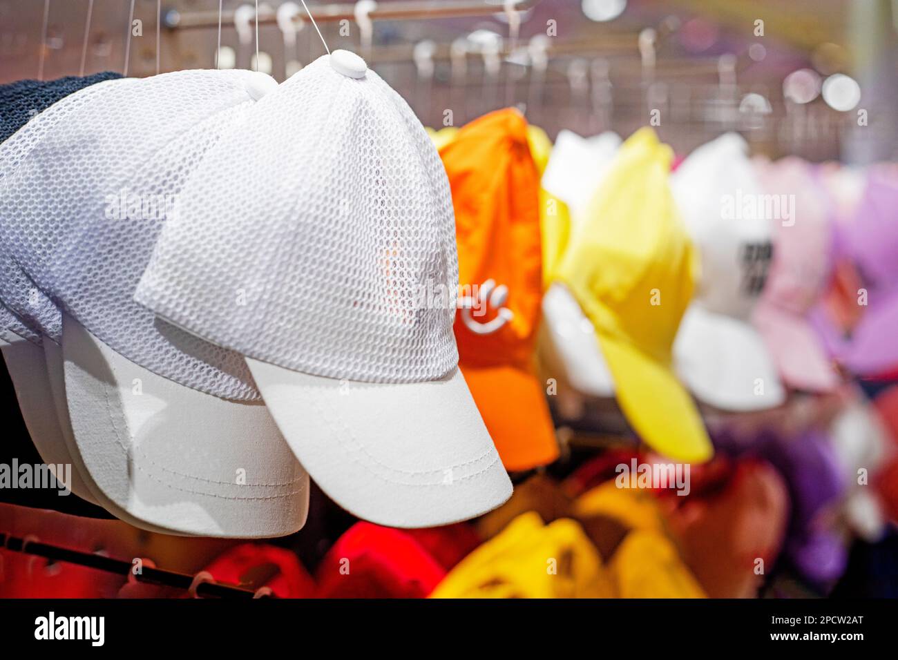 multi-colored summer caps in the store. Summer is coming Stock Photo ...