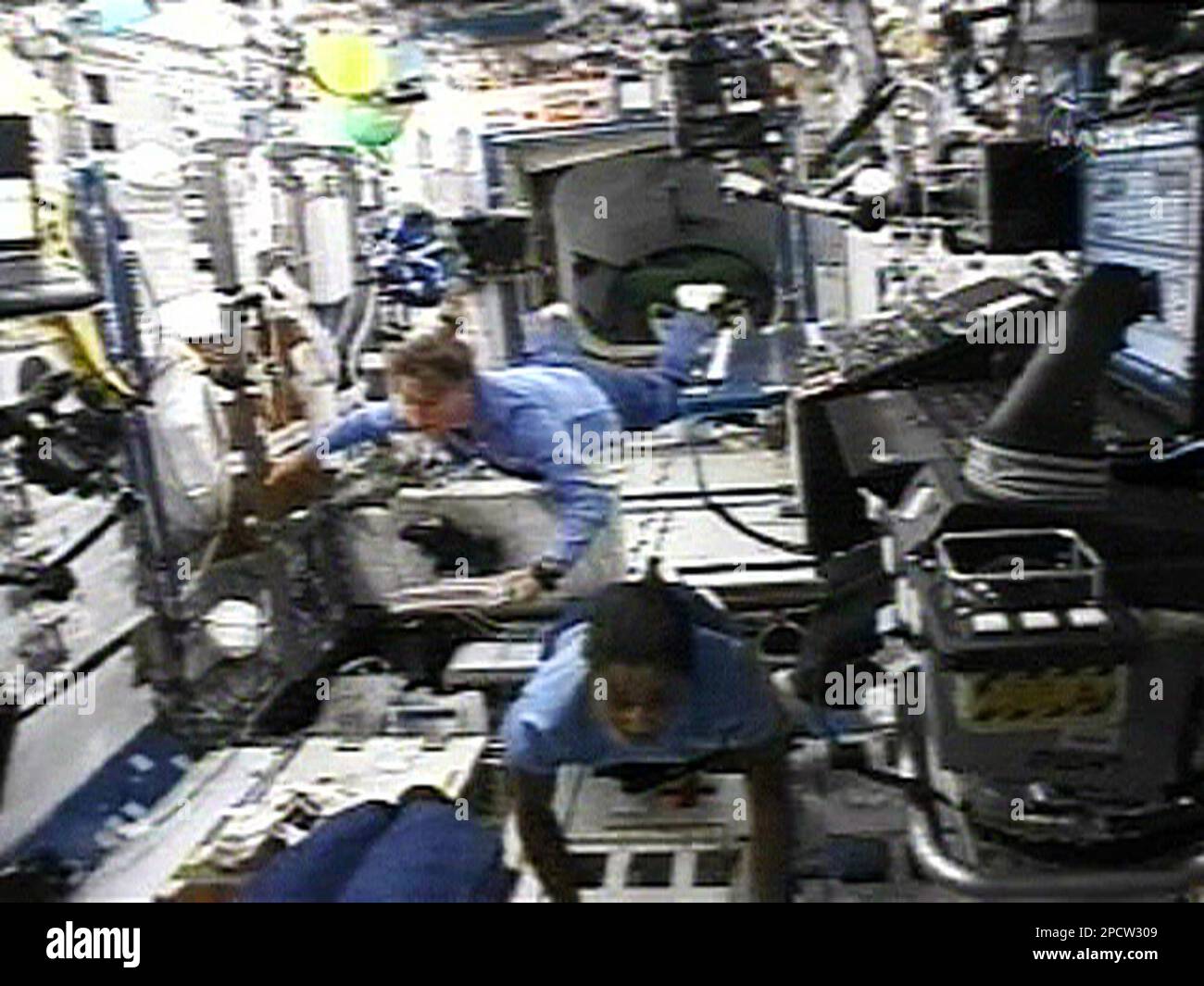 In this image made from NASA TV, astronaut Lisa Nowak floats over ...