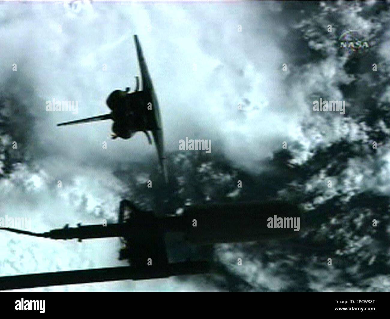In this image made from NASA TV,astronauts aboard the Space Shuttle ...