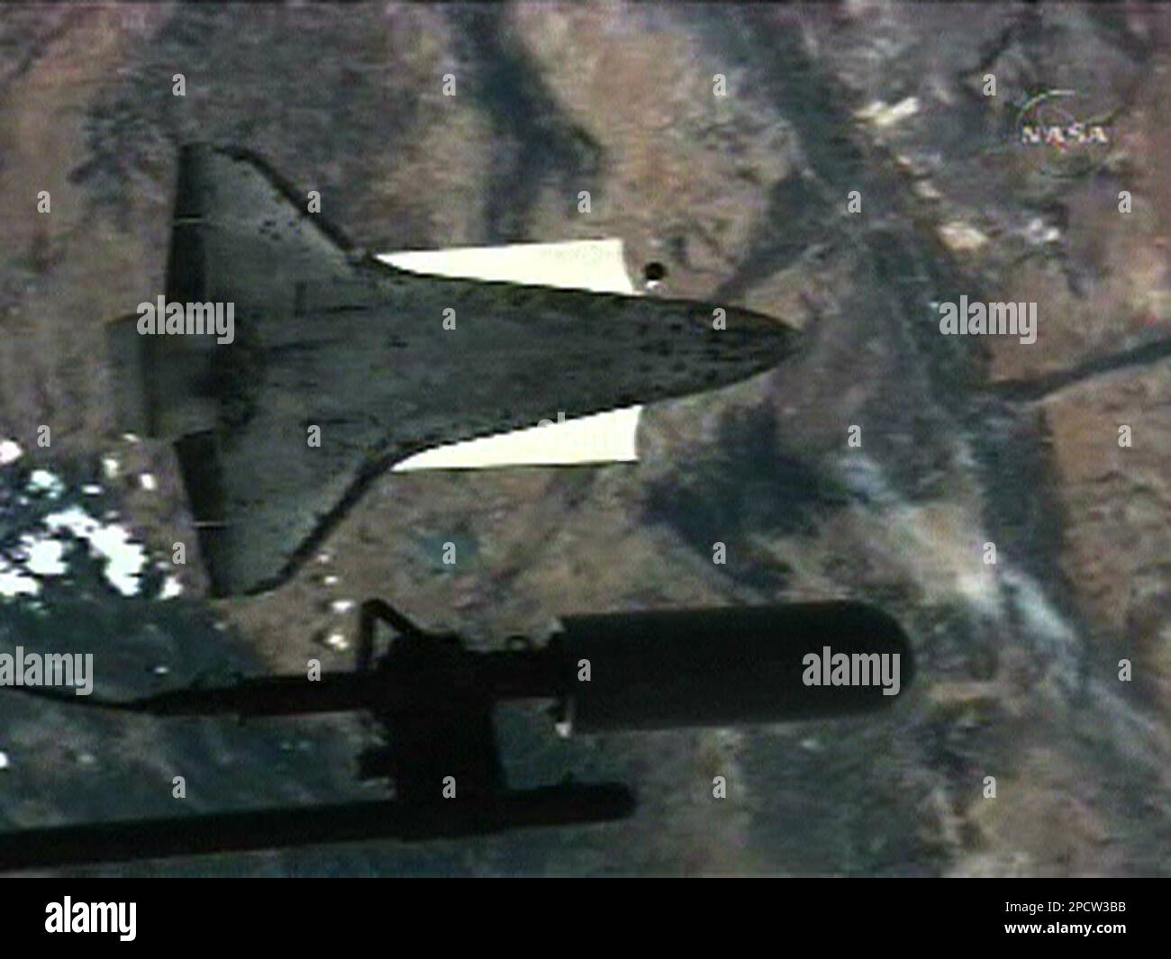 In this image made from NASA TV,astronauts aboard the Space Shuttle ...