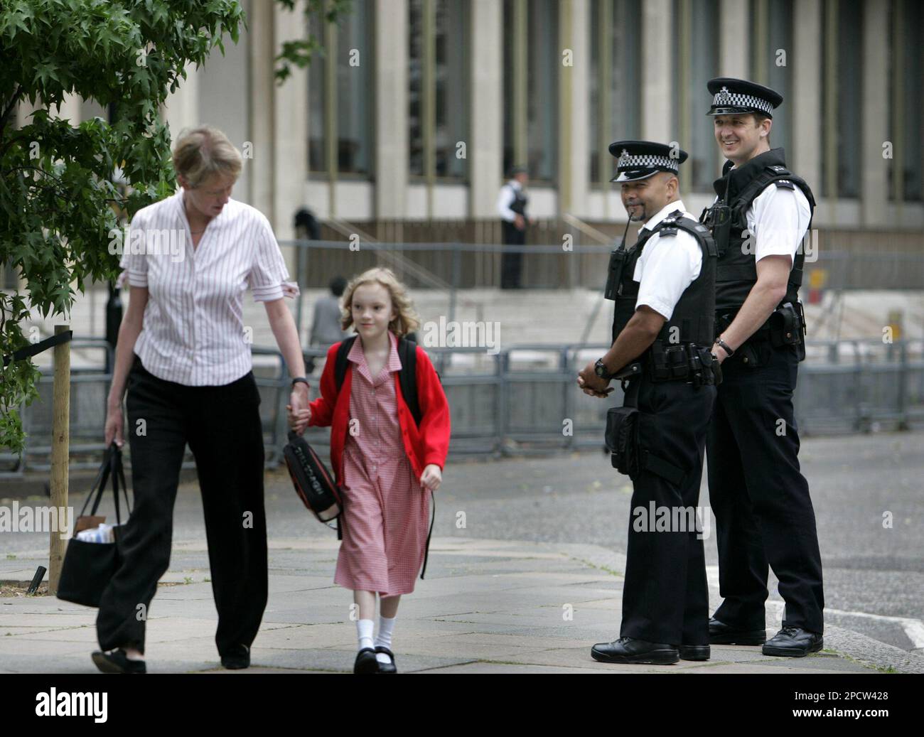 British police officers stand guard outside the United States embassy ...