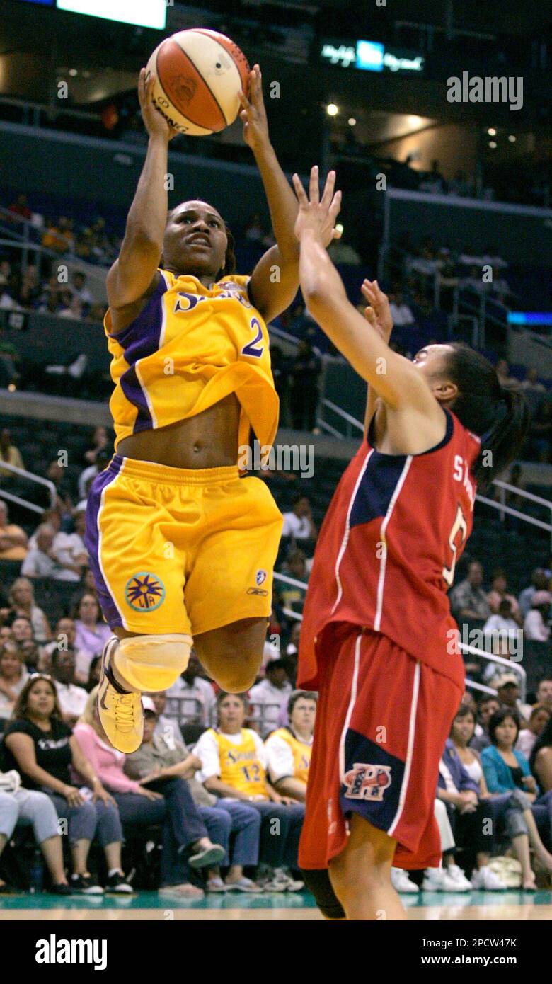 Los Angeles Sparks' Temeka Johnson, left, shoots over Houston Comets ...