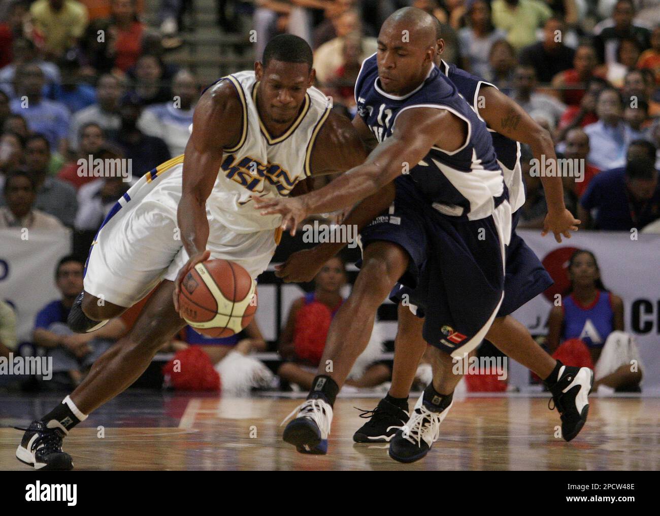 U.S. Virgins Islands basketball player Victor Cuthbert, right, dribbles ...