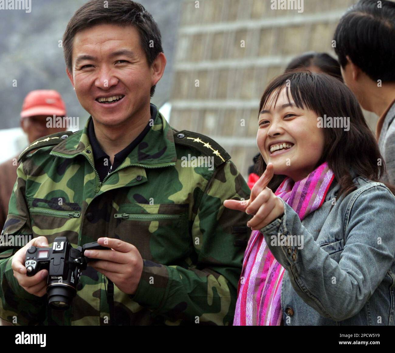 Chinese civilian Chen Xiao, right, and an unidentified Chinese military ...