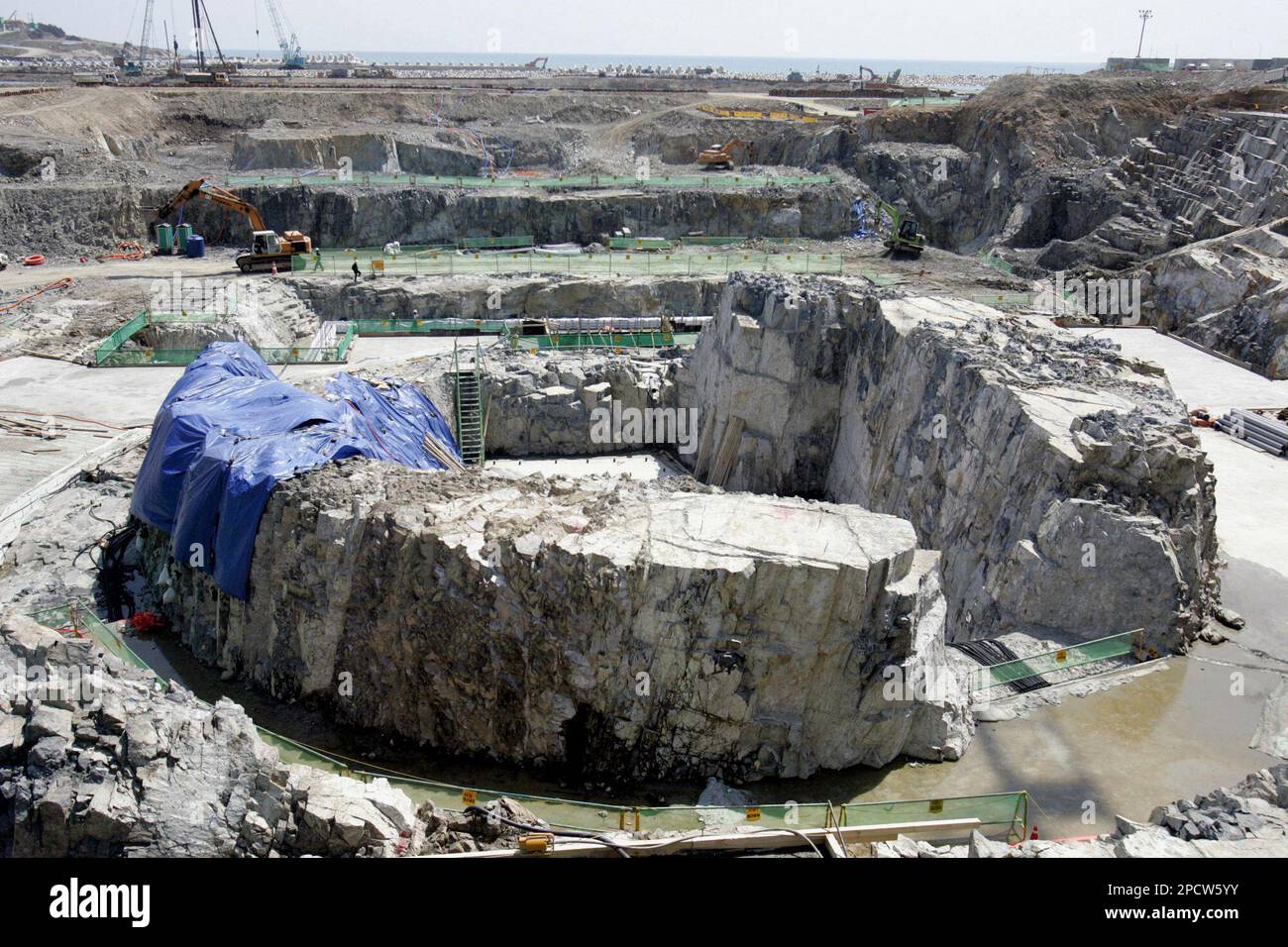 ** ADVANCE FOR SUNDAY, JULY 9 **Workers work at the construction site ...