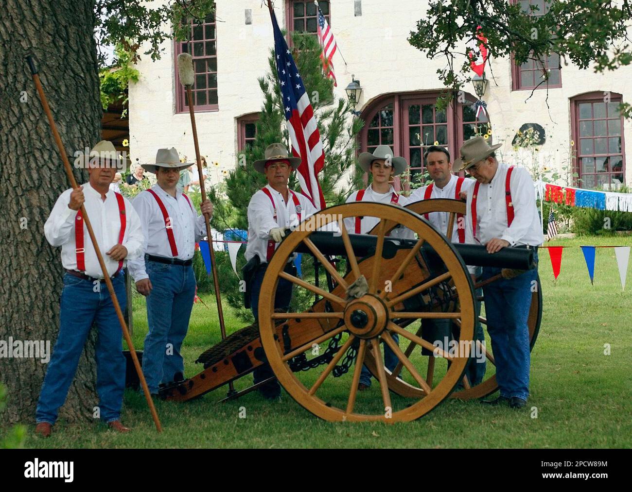 Tom Lupton, right, and his canon crew, pause before emplacing his Civil ...