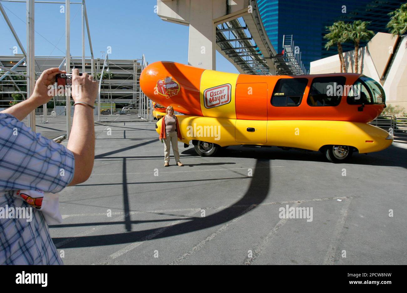 ** ADVANCE JULY 4 ** Tourists snap photographs with a Oscar Mayer ...