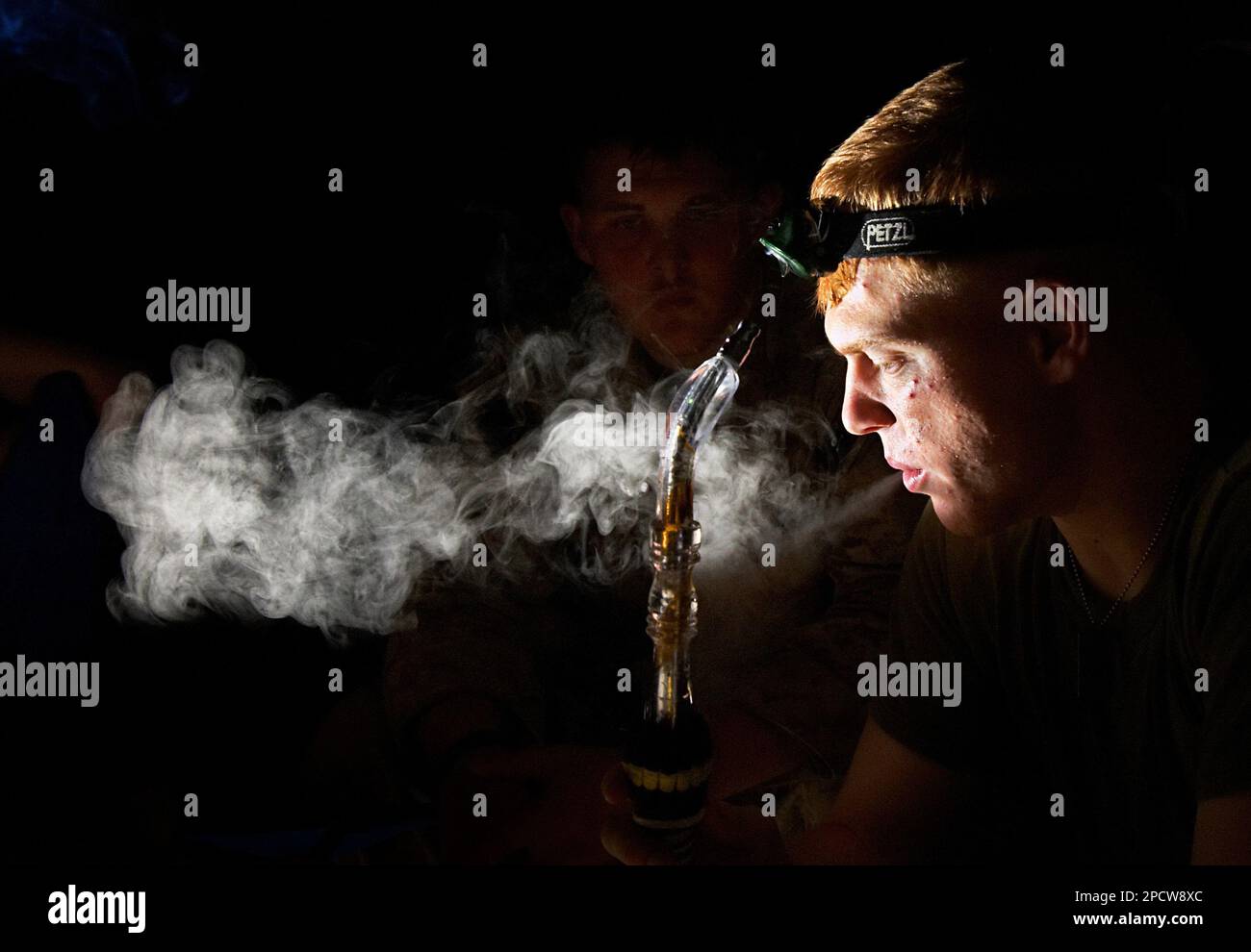 U.S. Marine Lance Cpl. Tony Mallett, of Orange, Massachusetts, smokes ...
