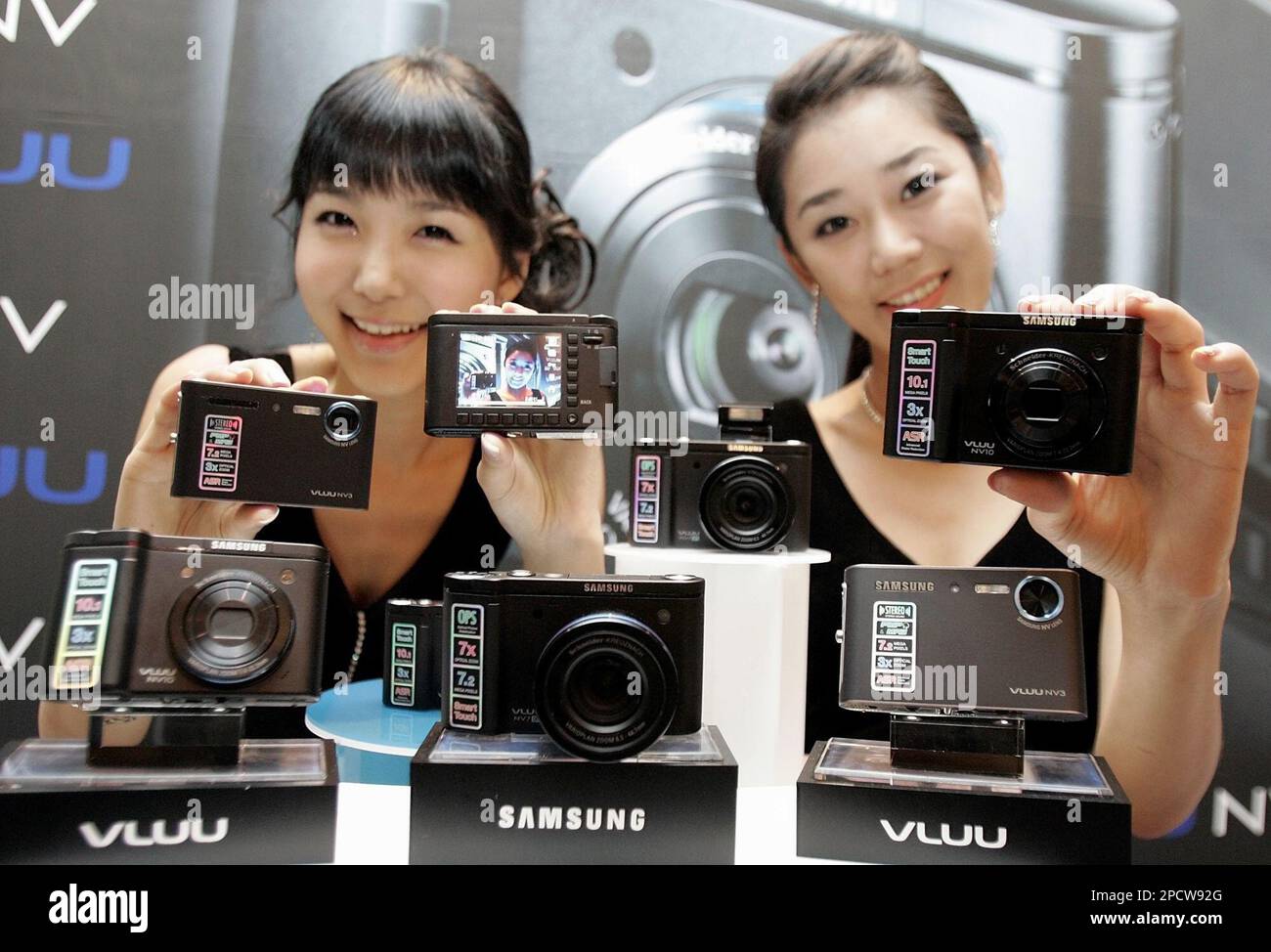 Models introduce Samsung's new digital camera line up, VLUU NV10 with 10.1-megapixel, top right ...