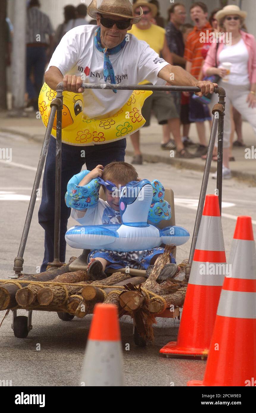 Jacob Collett, 4, works to put on a pair of goggles as his grandfather ...