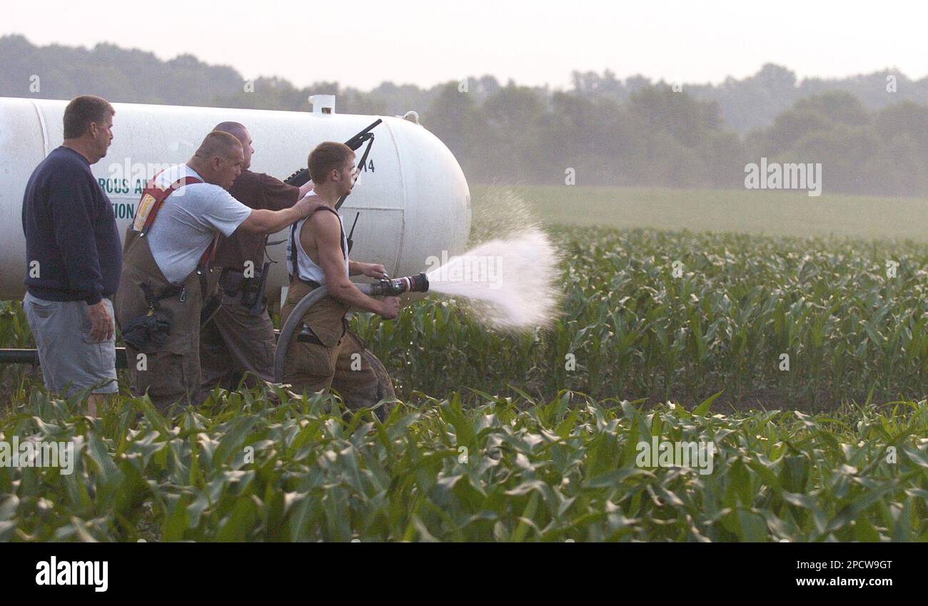 Southwest Fire Department firefighters start water to stifle fumes from ...