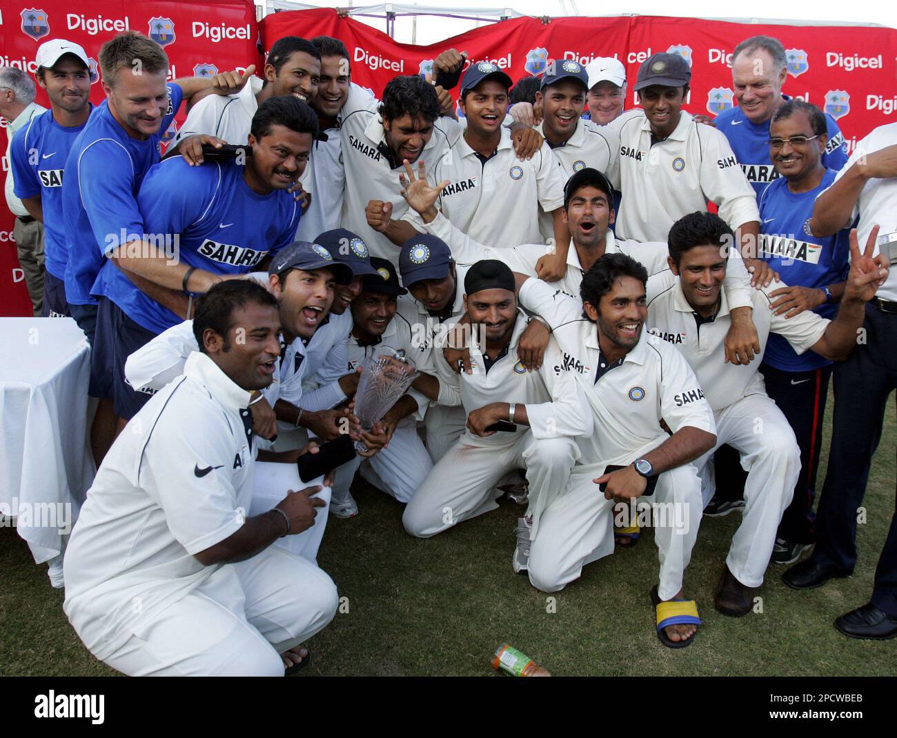 India's cricket team poses with the trophy after defeating the West ...